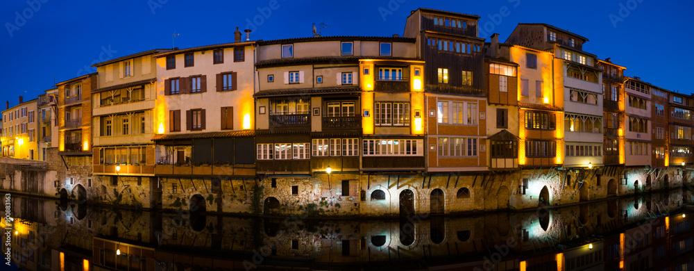 Scenic twilight view of houses of Castres city on Agout river in ...