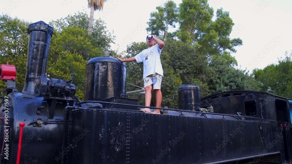 Wide , push in panoramic footage of 10 years old caucasian boy, walking ...