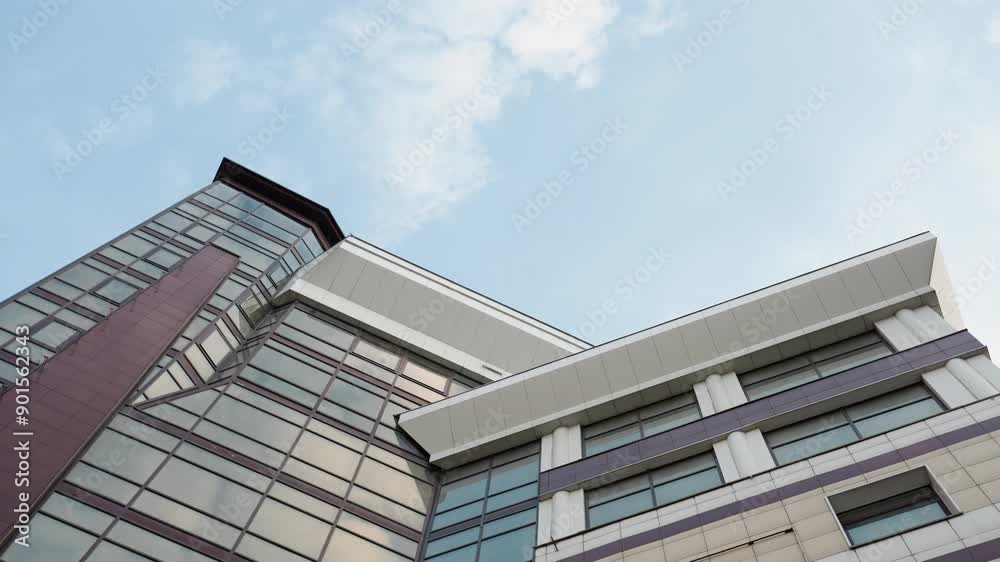 Close rotational view of a modern city building with a sleek glass ...
