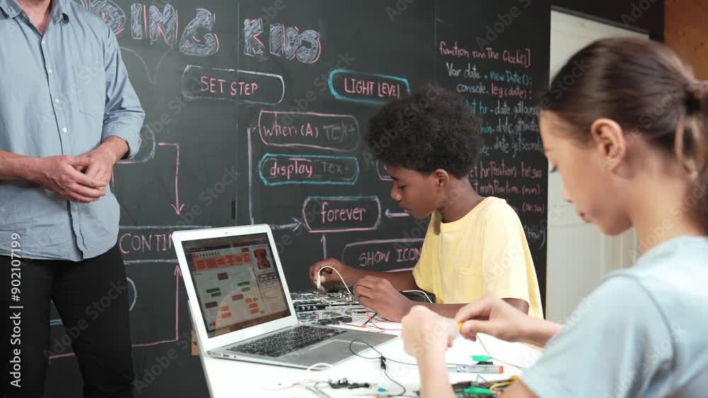 Teacher teaching about coding system while diverse academic student ...