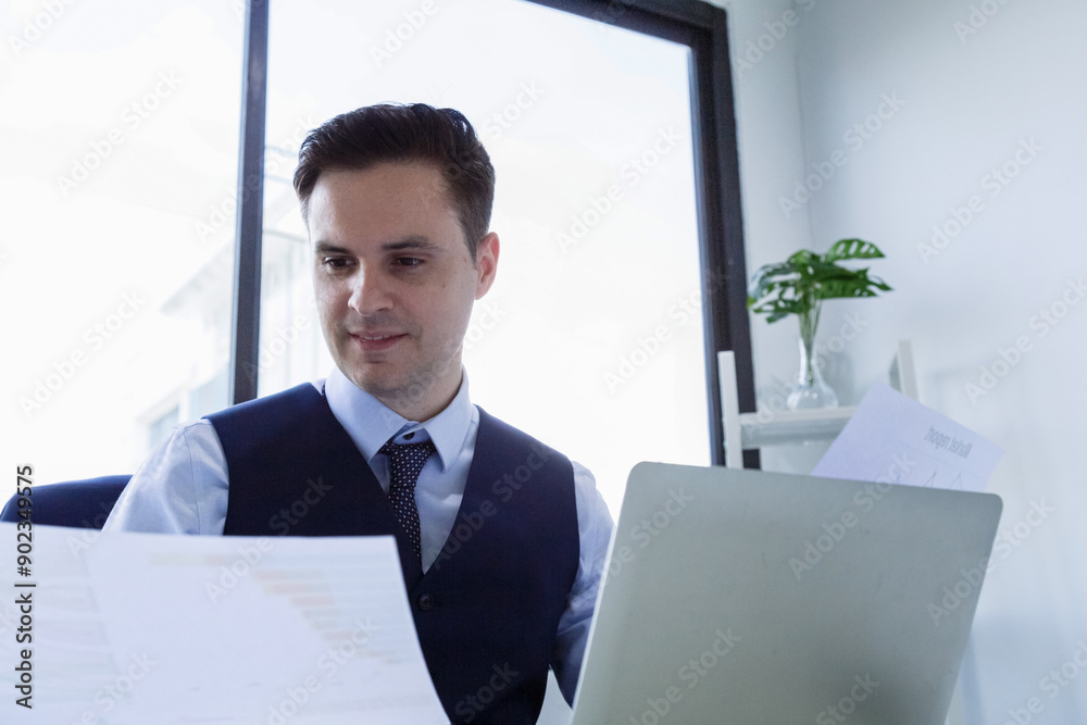 Businessman analyzing financial report documents and investment ...