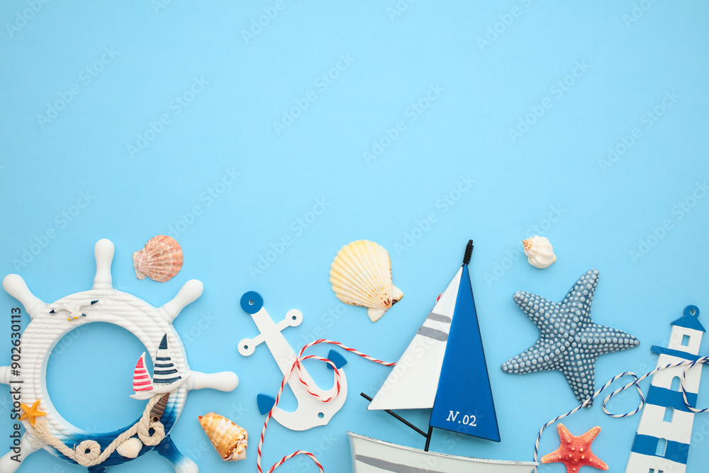 Nautical themed decor on a blue background featuring a sea wheel ...