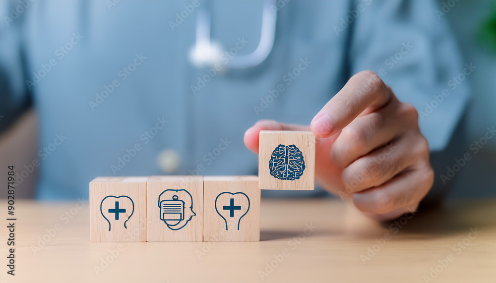 Hands holding wooden cube with drawing of brain, concept of healthcare ...