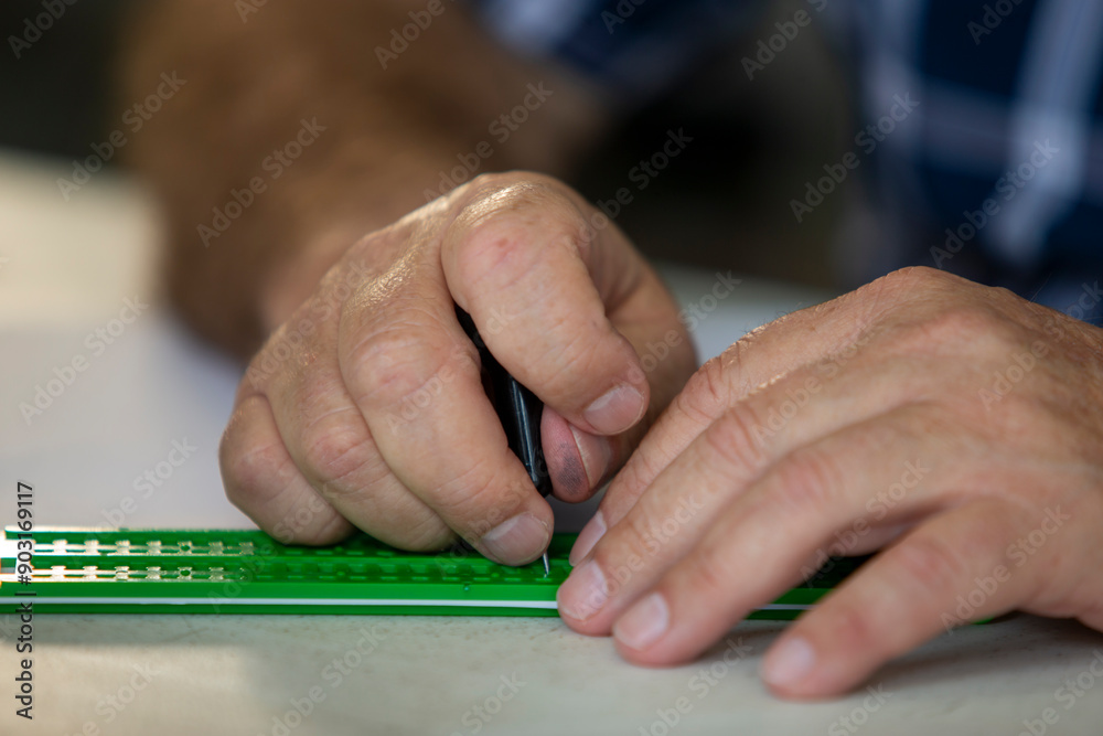 disabled person using a ruler to write in braille.Braille writing Stock ...
