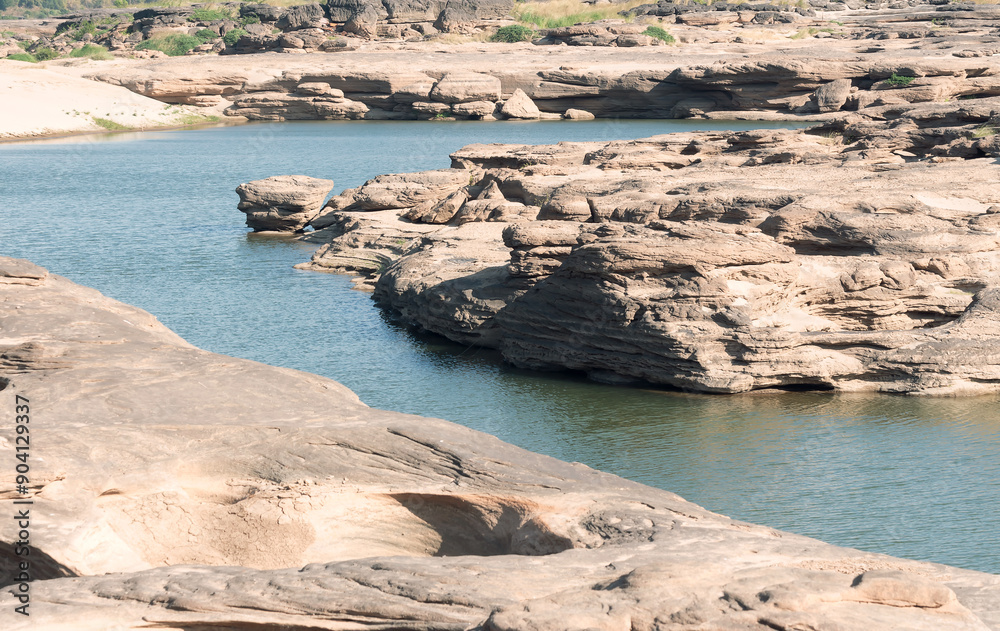 Sandstone formed from the accumulation of sand in the Mekong River, a ...
