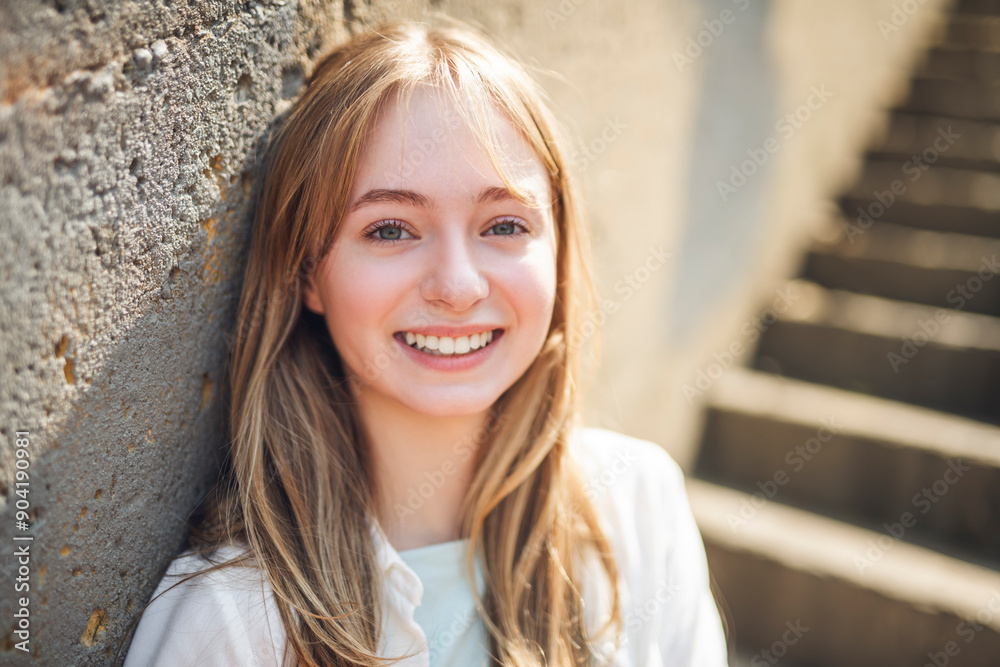 young woman on street, generation z girl posing outdoor backlit with ...