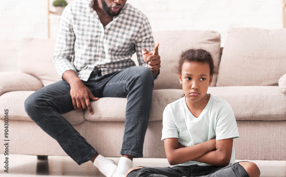 Angry unrecognizable father scolding stubborn african american daughter ...