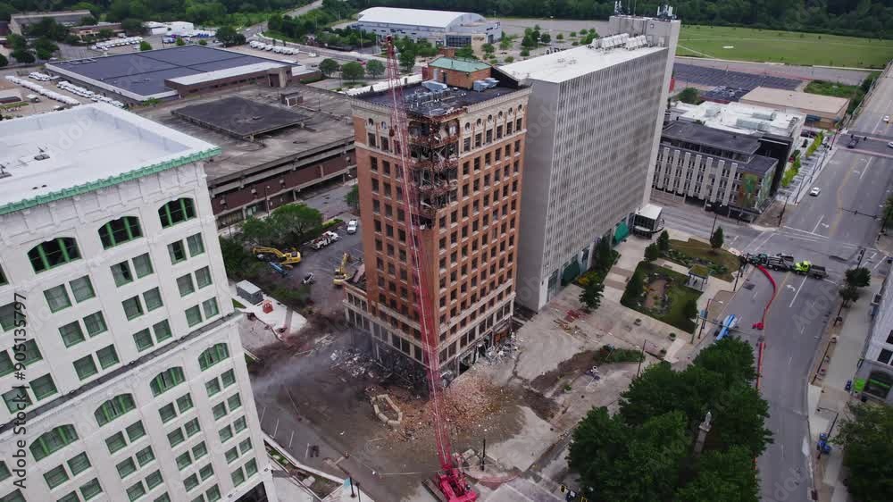 An aerial perspective capturing the demolition of a high-rise building ...