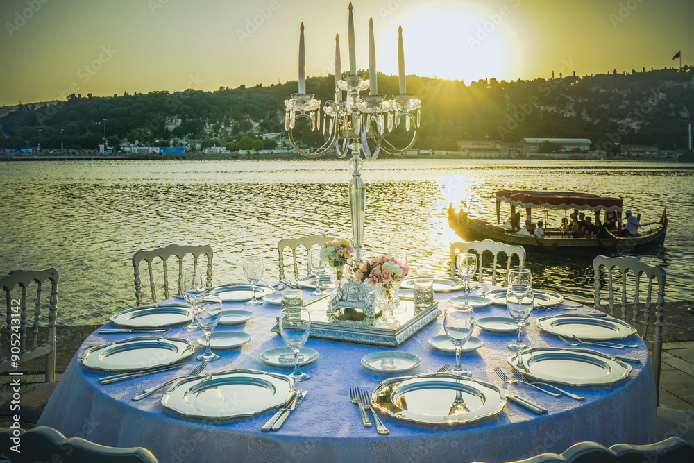 Photo of the magnificent invitation table combined with the sunset. An ...