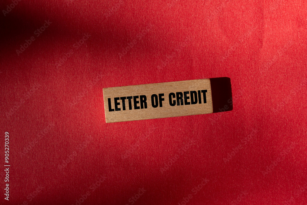 Letter of credit message written on wooden block on red background ...