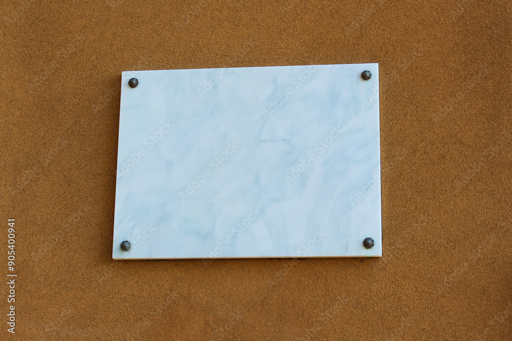 Blank marble sign on a wall of a building mockup. Empty marble signage ...