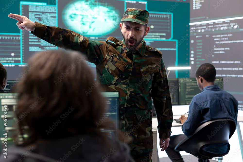 Military IT experts working on cyber security in a high tech government ...