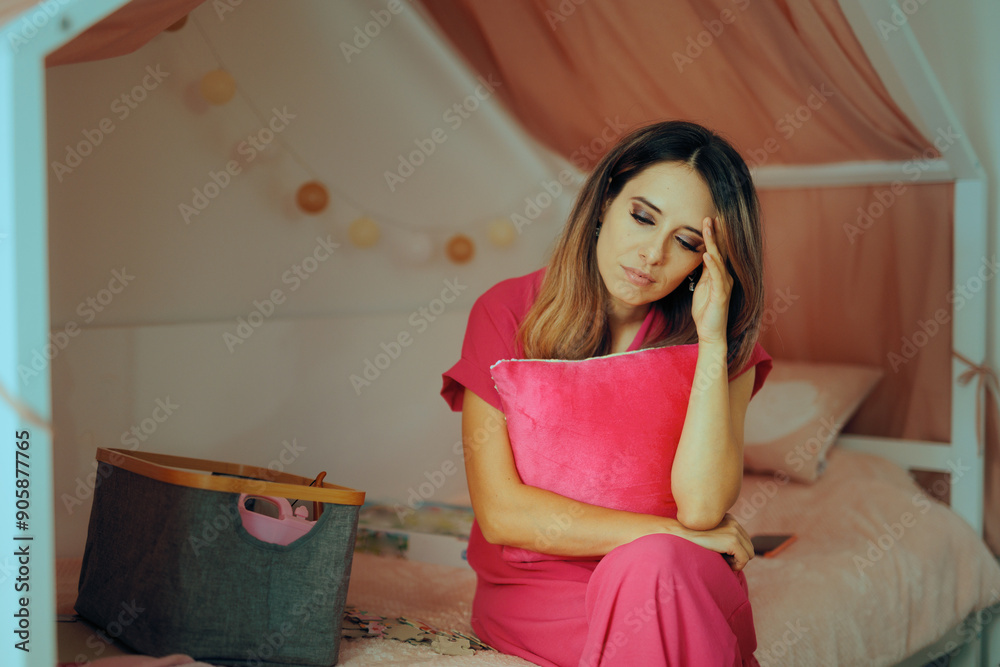 Sad Mom Sitting in a Kids Room By Herself . Mother feeling unhappy and ...