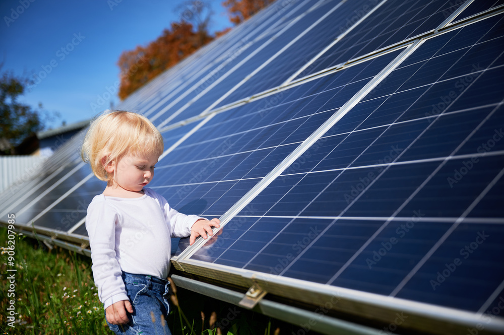 Little boy wondering what solar panel is. Inquisitive kid exploring how ...