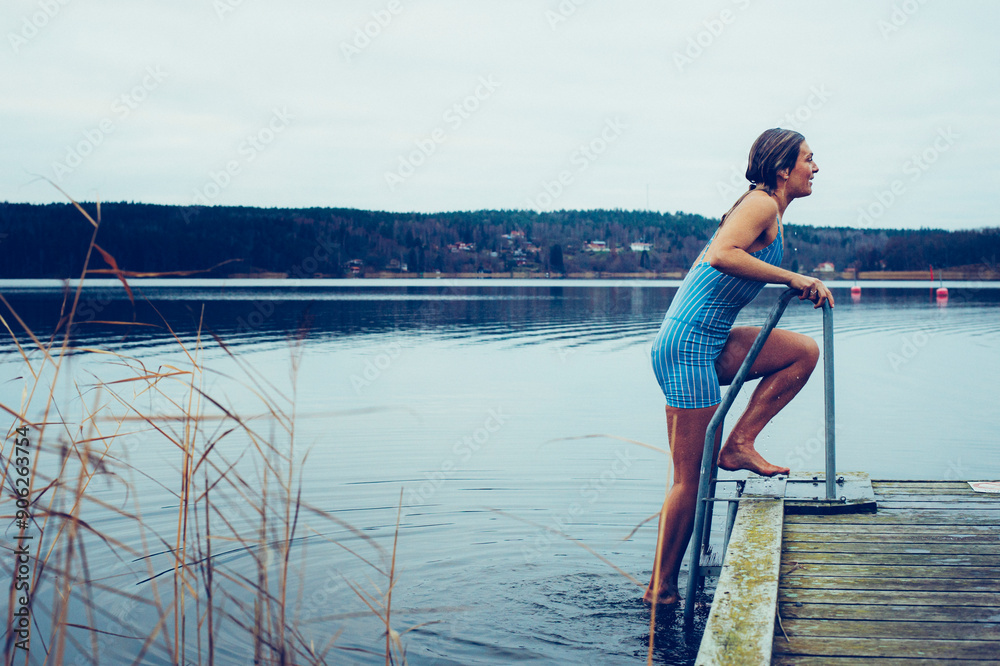 Life Outdoors - woman in bathing suit in a cold Nordic lake Stock Photo ...