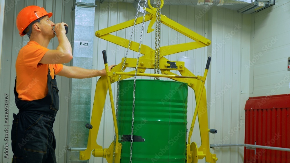 Warehouse operator communicates paint barrel placement via radio ...