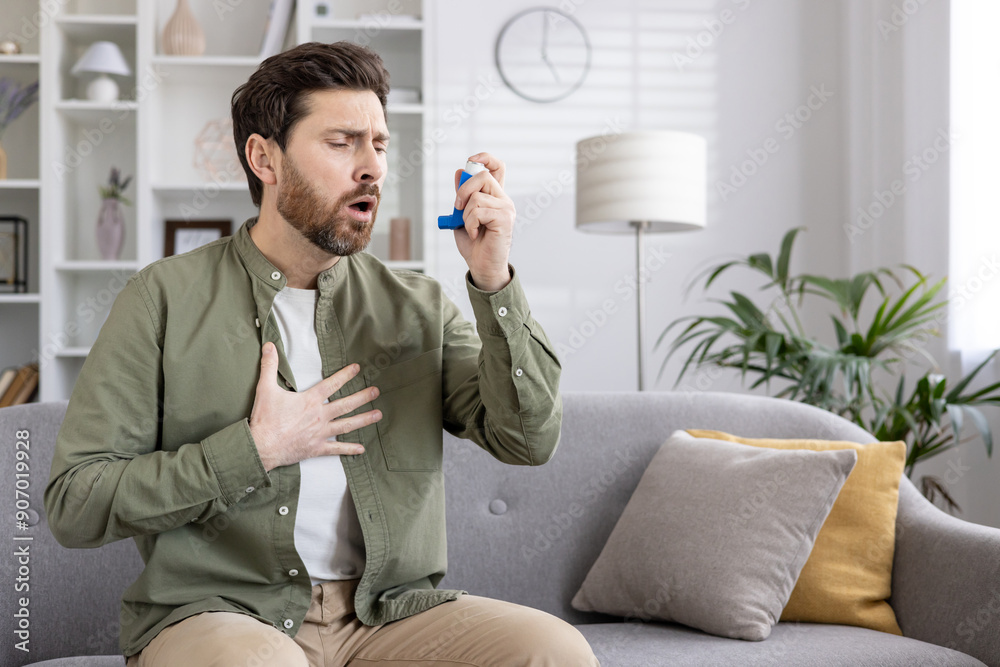 Man experiencing breathing difficulty while using asthma inhaler ...