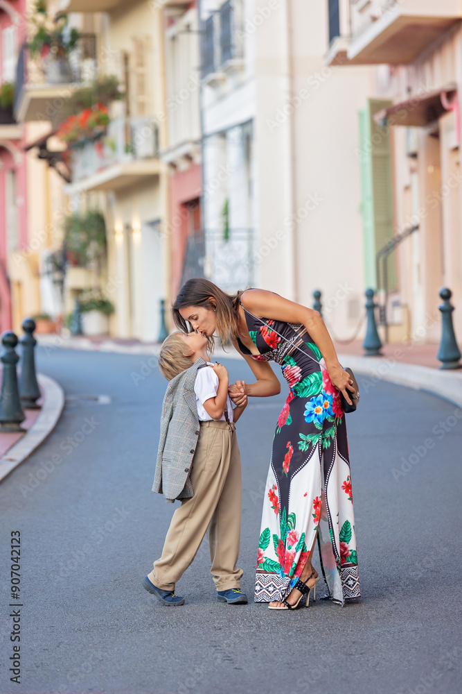 Smart casual children in suits, ties and bows, walking on a narrow ...