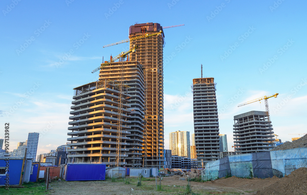 Construction of a skyscraper. Tower Crane on formworks on construction ...