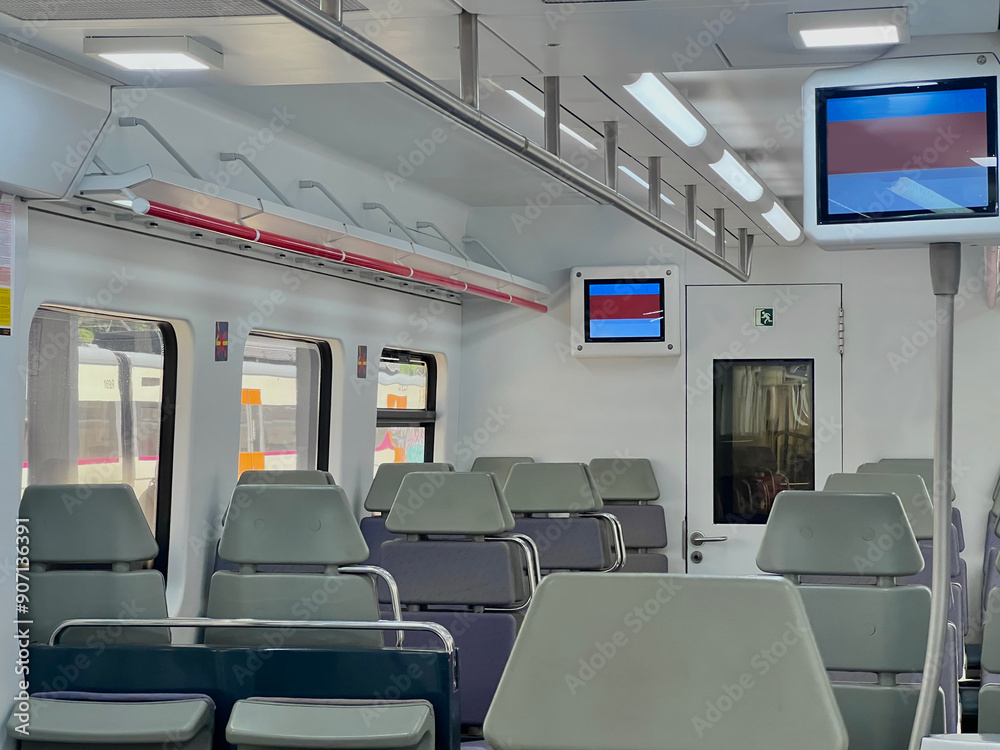 Empty cabin of a modern passenger train. Empty seats inside train cabin ...