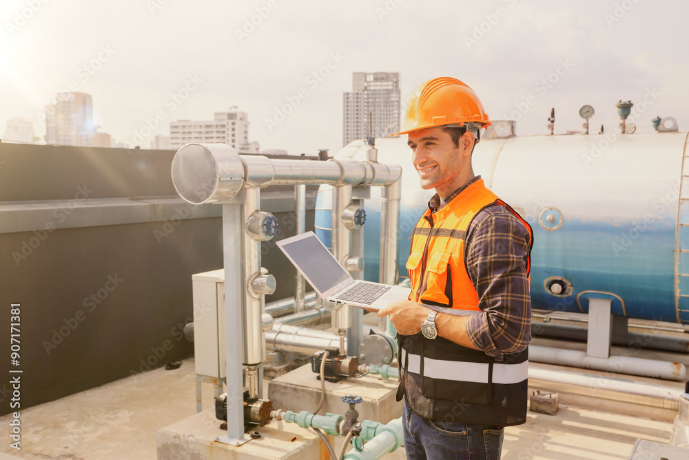 Portrait male HAVC refrigeration system technician holding laptop ...