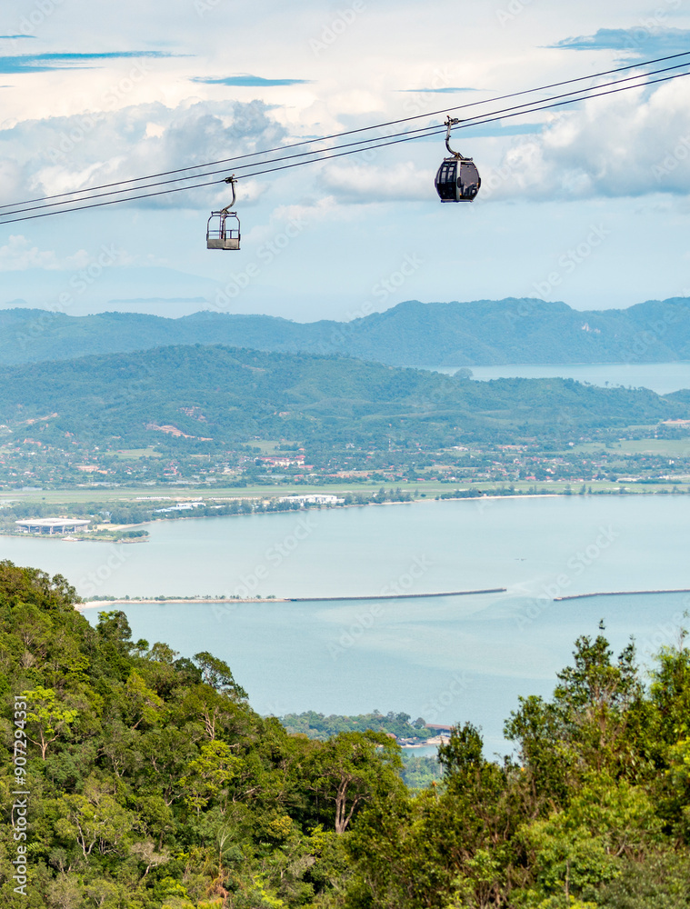Langkawi cable cars, on a gondola lift,moving across the landscape of ...