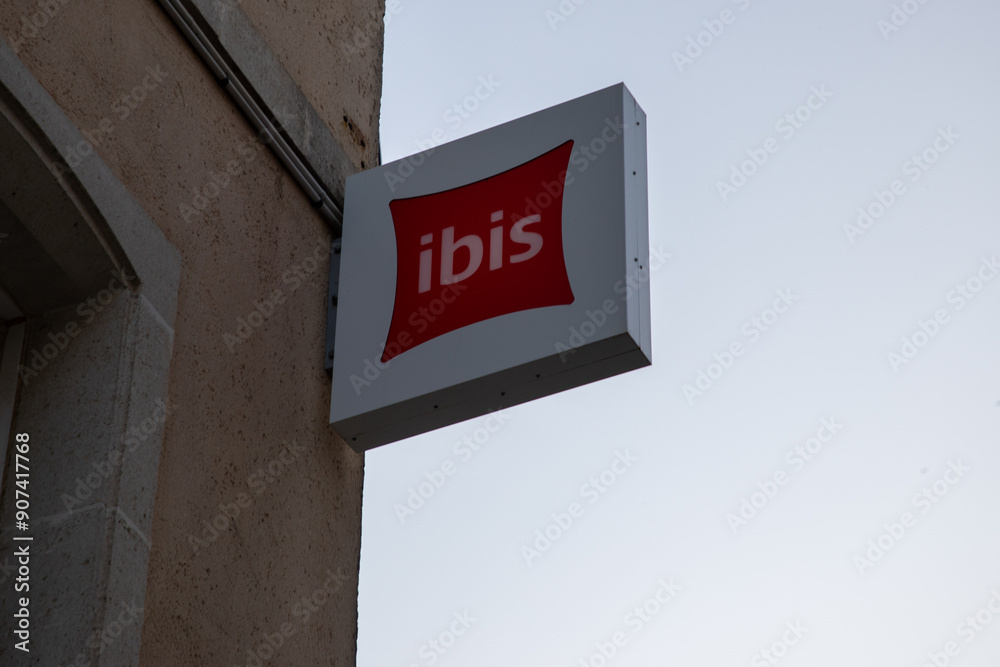 ibis styles red pillow sign logo and brand text hotel wall entrance ...