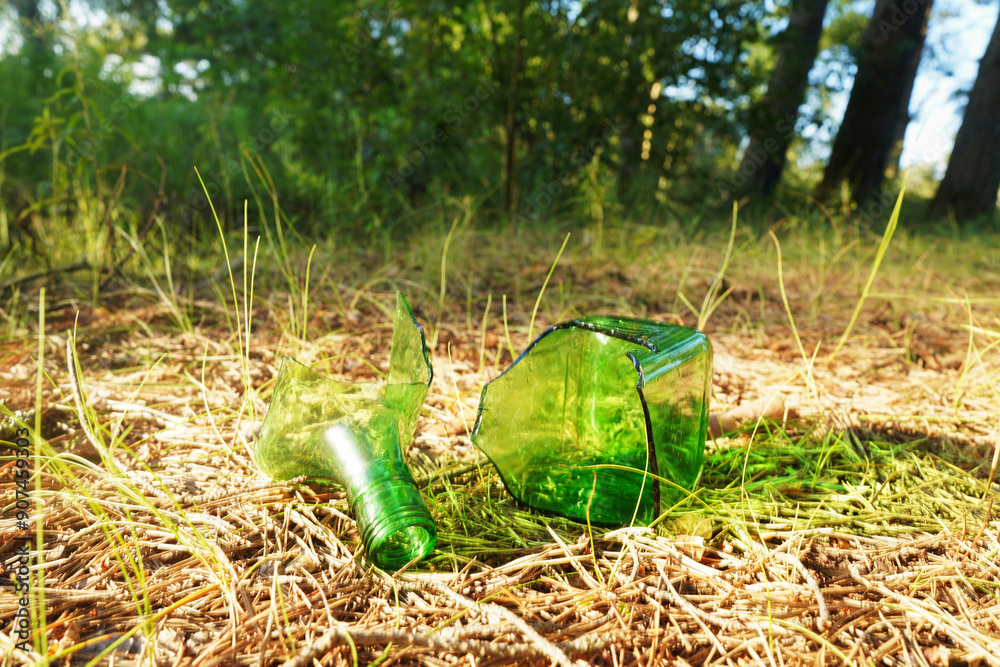 Broken glass bottle on ground. Broken Glass on ground in the forest ...