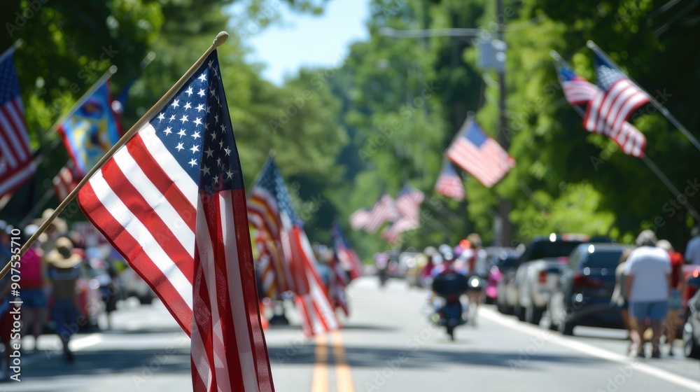 A row of American flags lining a parade route, creating a patriotic ...