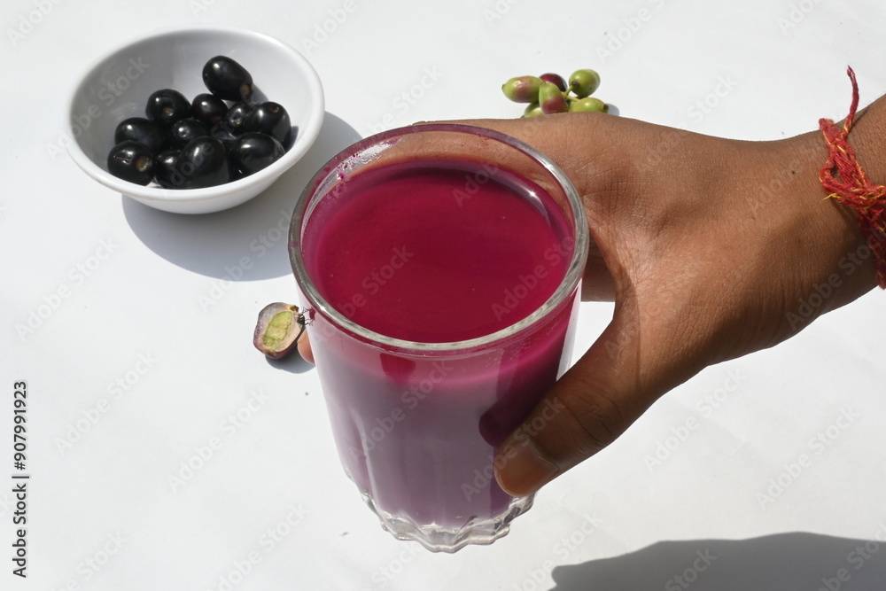 Syzygium cumini fruits juice. Its other names Malabar plum, Java plum ...