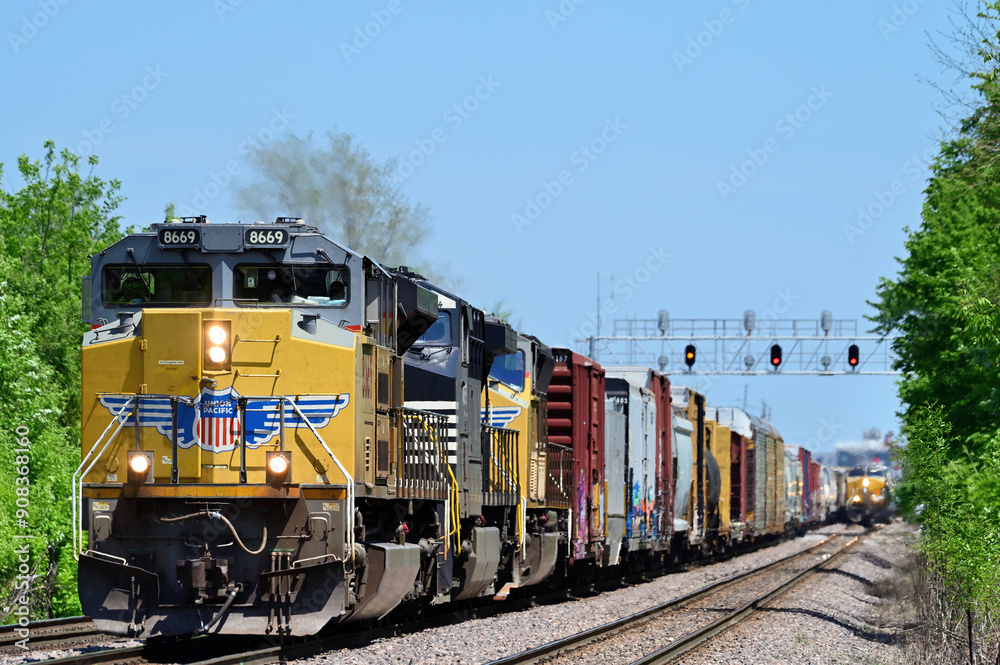 With another westbound freight train slowly overtaking it, a Union ...