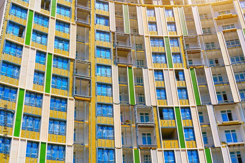 Cladding and warming wall of monolithic house under construction ...