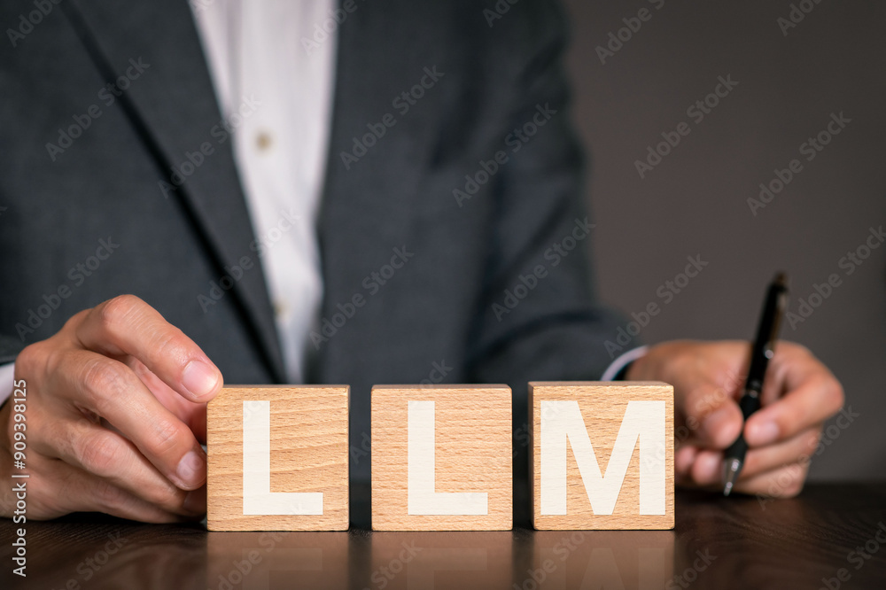 There is wood cube with the word LLM. It is an abbreviation for Large ...