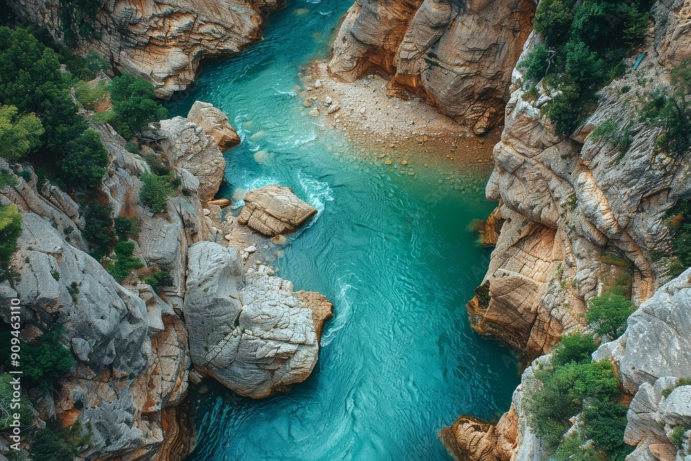 Aerial view of the crystal-clear blue-green Kali River flowing through ...