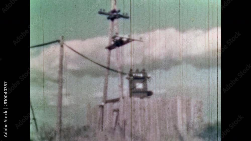 Archive film, Utility workers maintain high voltage power lines on ...