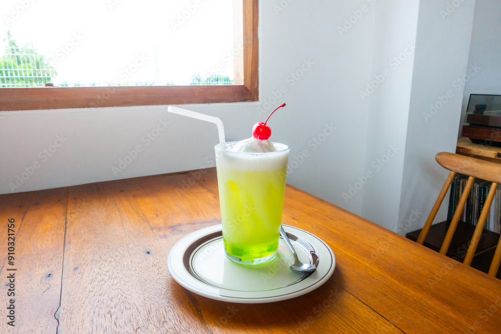 Melon soda float with vanilla ice cream and cherry on top in summer time,Melon soda is one of ...