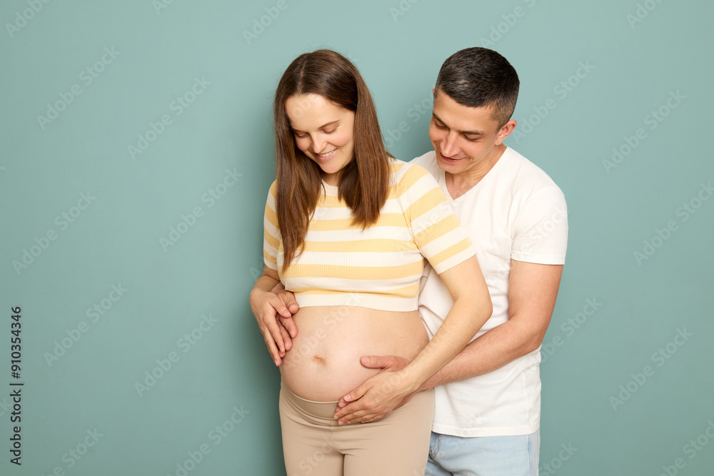 Loving couple in love cheerful gentle woman with pregnant belly and man ...