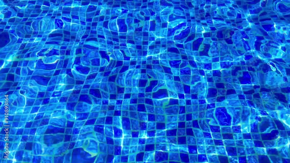 Reflecting water of swimming pool surface on a day. Blue water in the ...