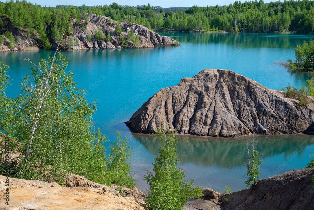 Lake with azure water in the natural and anthropogenic complex of ...