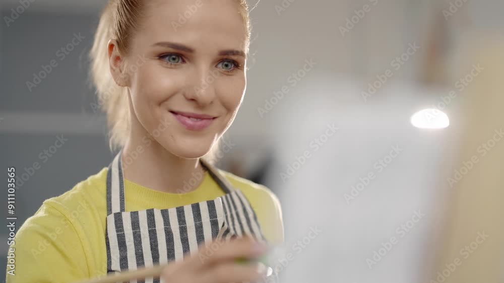 Portrait of inspired talented woman artist during work in art studio ...