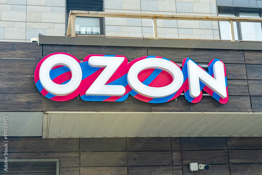 MOSCOW, RUSSIA - 01.08.2024: OZON sign on the house. OZON logo, Russian marketplace, attached to ...