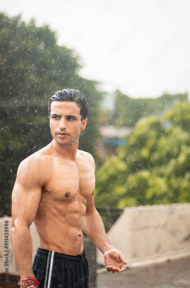 An Indian fitness enthusiast with a lean, muscular build stands ...