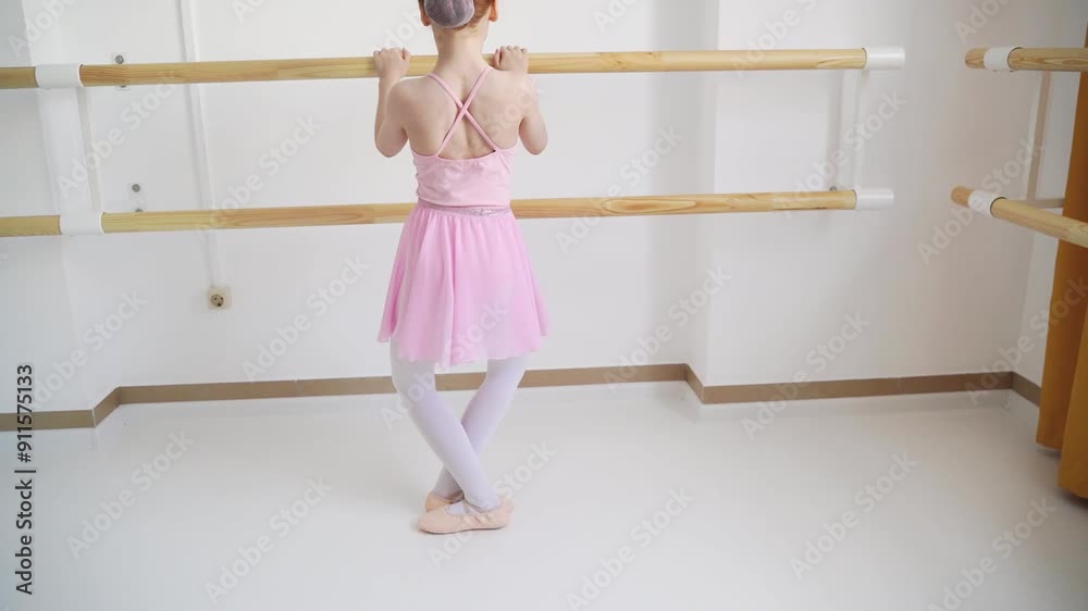 Young ballet girl at studio lesson. Training performance. Stretching ...