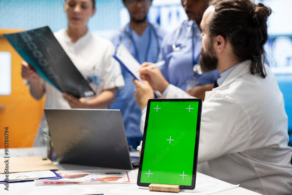 Licensed doctor and his staff review x ray scan results next to ...