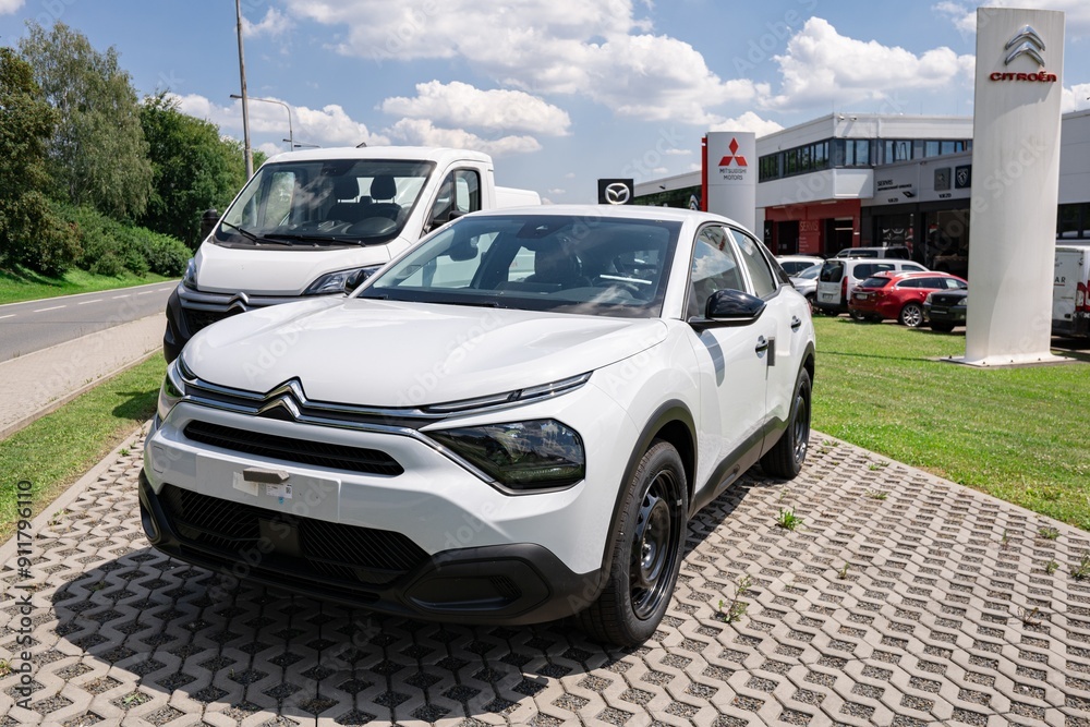 White Citroe C4 crossover car in front of dealership building prepared ...