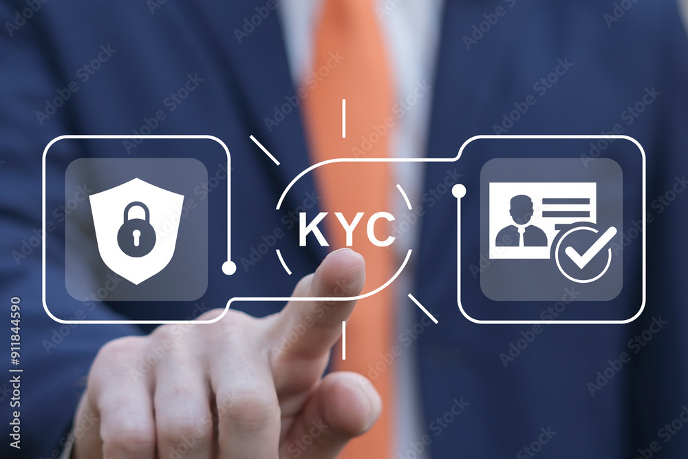 Business man working on virtual touch screen presses abbreviation: KYC ...