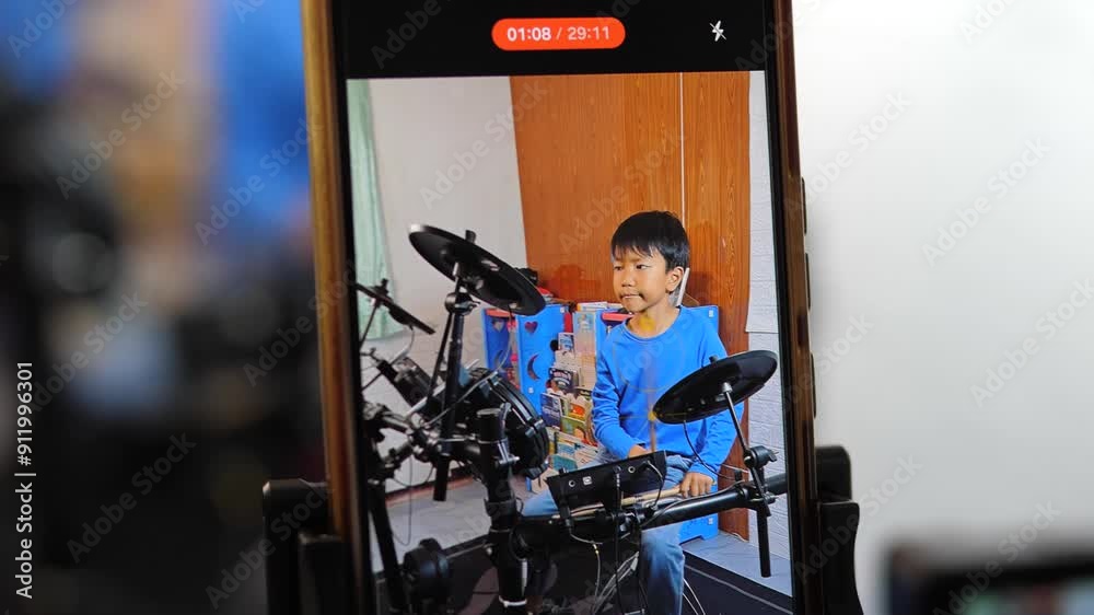 Digital content creator, asian child boy play electronic drum with fun ...