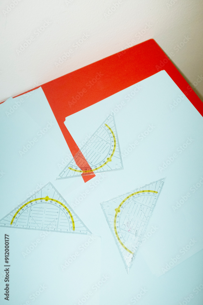 Set square rulers on business office desk and hard direct flashlight ...