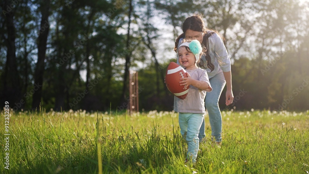 child playing American football in the park. happy family kid dream ...