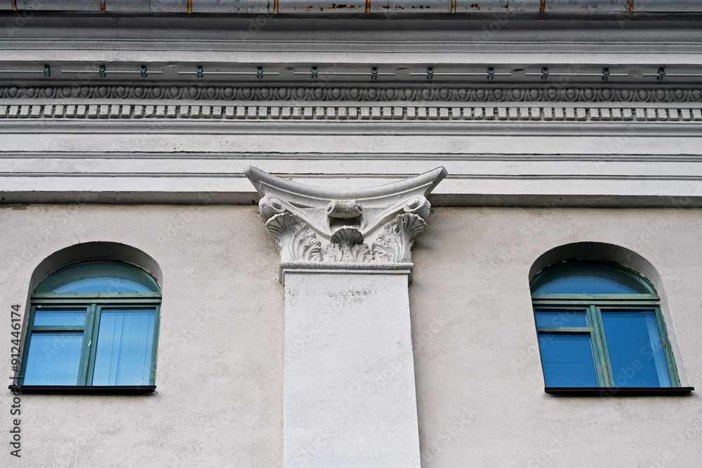 Pilaster capital on historic facade. Historic building facade ...